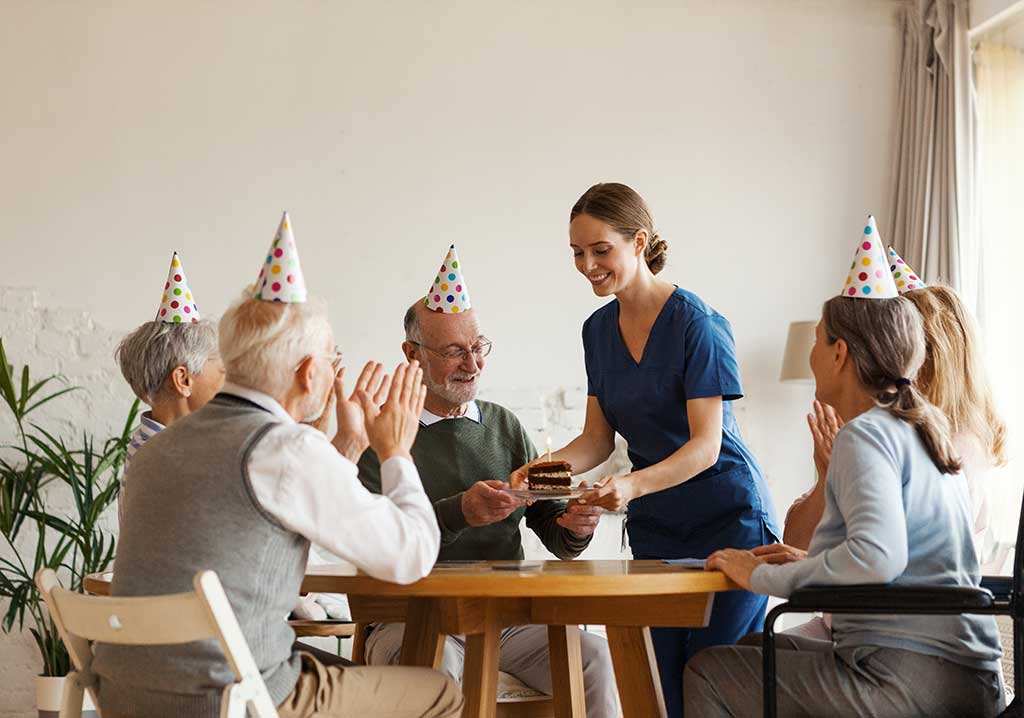 Happy Elderly People In Nursing Home